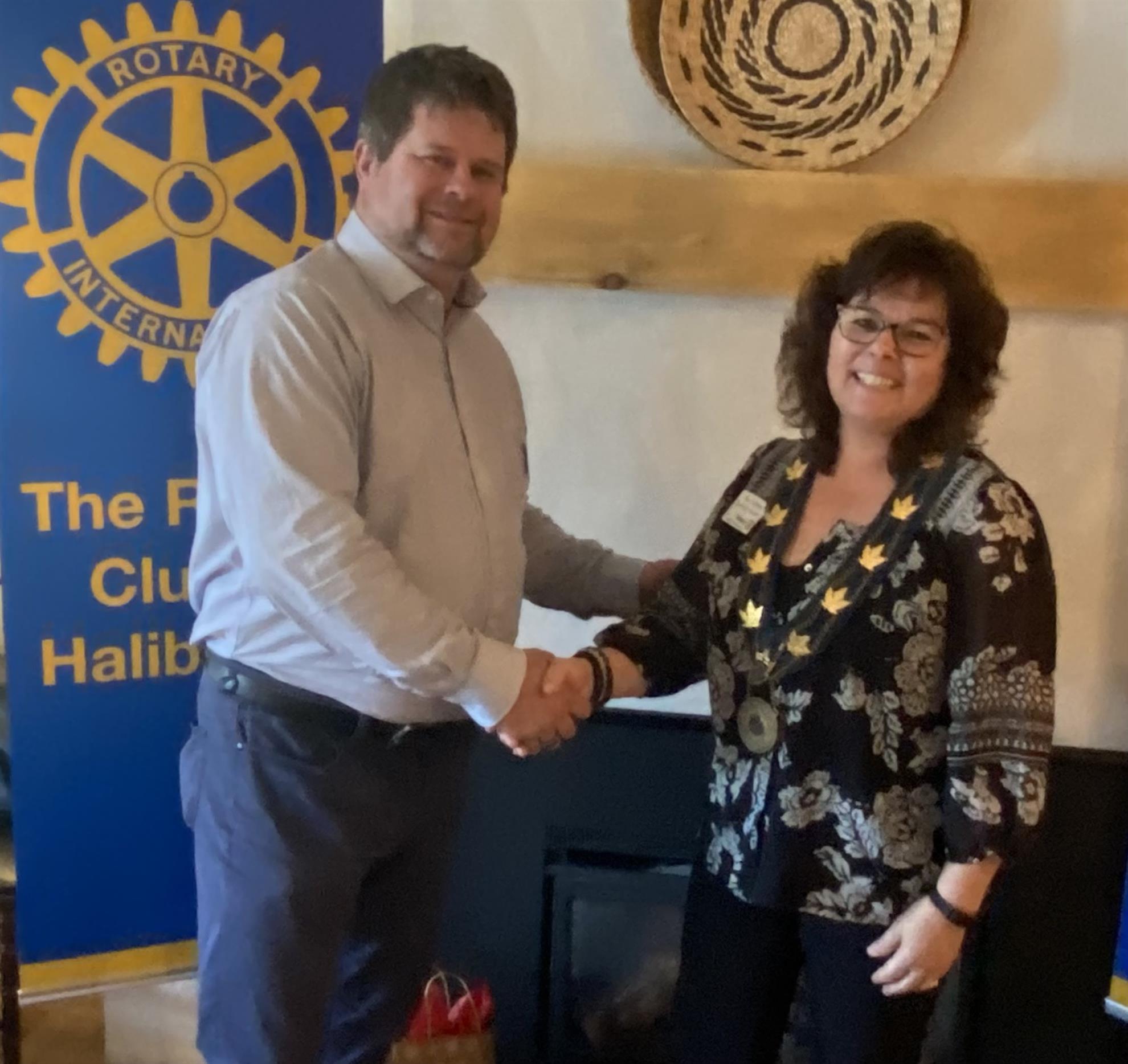 Aaron Hill inducts 24/25 President Sue Collings | Rotary Club of Haliburton