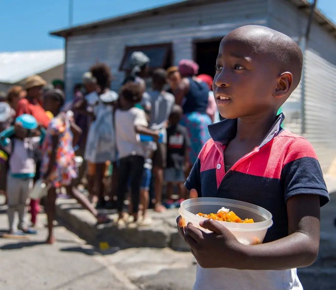 Kids learn to grow food and get to eat in marginalized South African ...